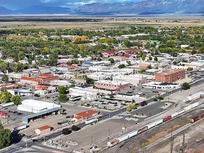 This aerial view reveals Alamosa's compact charm, nestled in the valley where mountains frame your everyday commute beautifully.