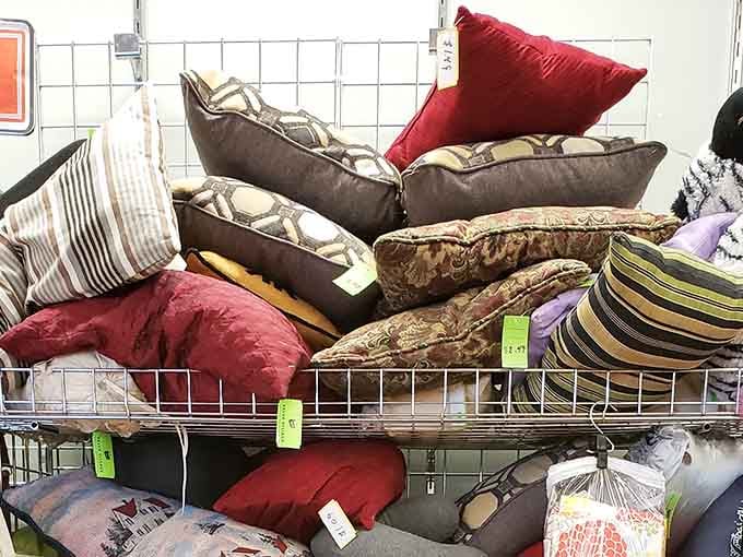 A mountain of decorative pillows offers instant home refresh potential, because sometimes your couch just needs new accessories.