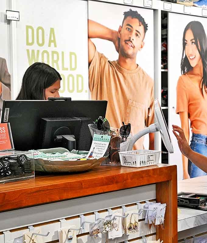 The checkout area where fashion dreams become reality. That "Do a world of good" sign reminds you that sustainable shopping benefits more than just your wallet.