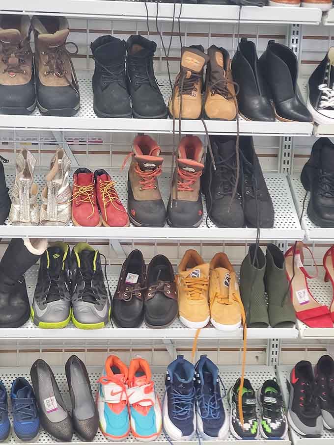 Footwear fantasies arranged by size, not style. Work boots neighbor with stilettos in this democratic display of second-chance shoes.