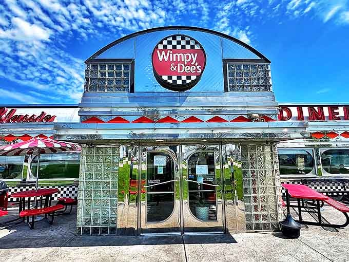 The entrance that promises everything will be alright once you're inside. That checkered logo isn't just branding&mdash;it's a finish line for hungry travelers.