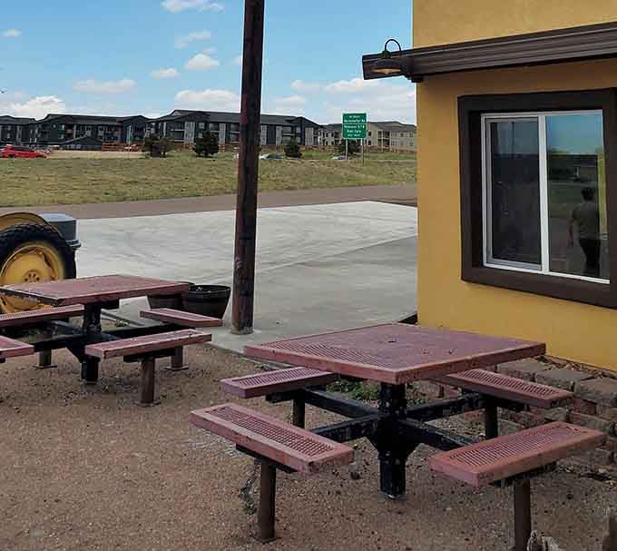Simple outdoor seating where the Colorado air somehow makes everything taste better, especially after conquering one of Sandy's legendary meals.