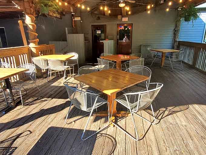 String lights and river breezes make this outdoor deck the perfect spot for summer evenings and cold drinks.