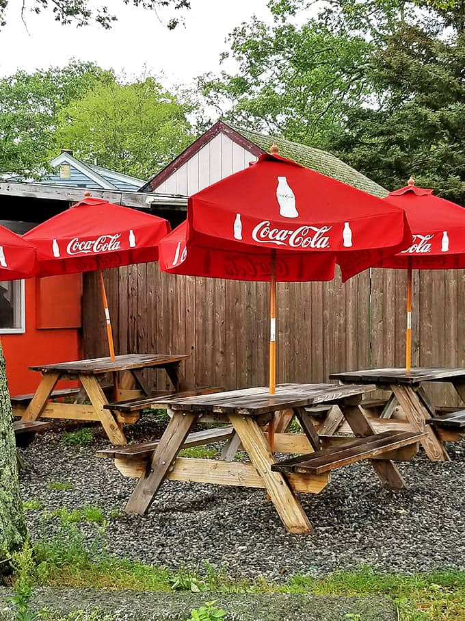 Outdoor seating under Coca-Cola umbrellas &ndash; because sometimes breakfast tastes even better with a side of fresh Rhode Island air and birdsong.