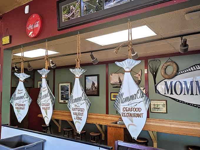 Fish-shaped banners proudly proclaiming specialties hang like trophies&mdash;visual proof that Momma O's takes seafood seriously.