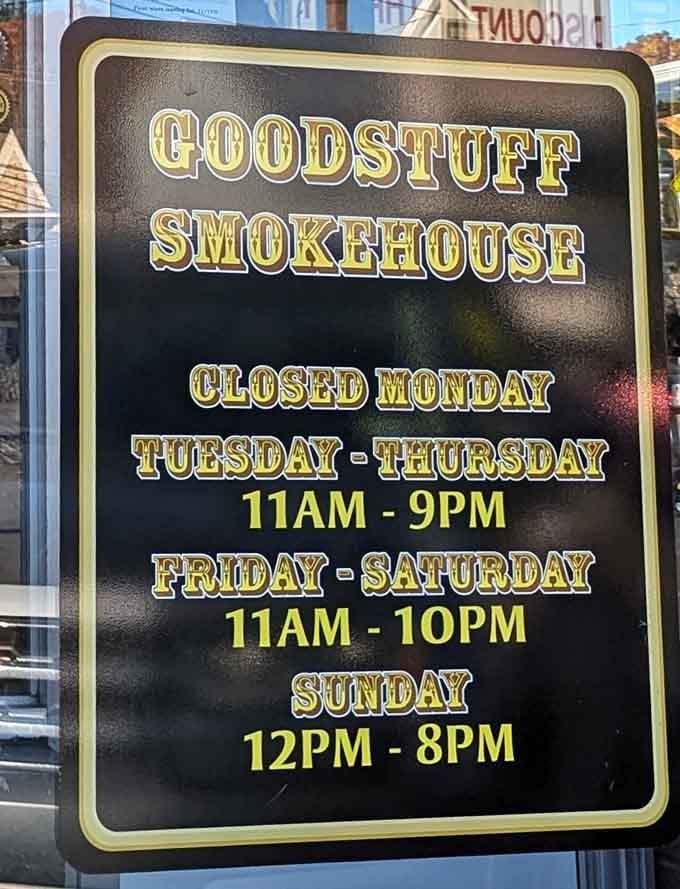 Even the hours sign has character. Closed Mondays because perfection requires rest, open when you need that BBQ fix most.