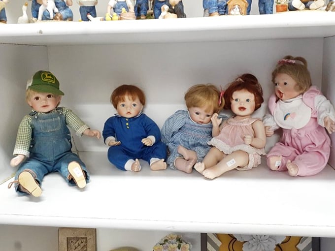 The doll shelf: where childhood memories sit in neat rows, their painted expressions frozen somewhere between charming and slightly haunting.