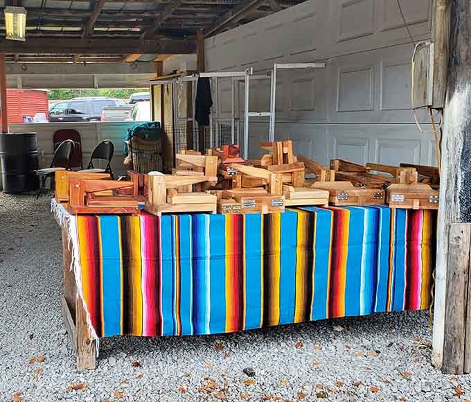 Handcrafted wooden treasures draped with a colorful serape—where Mississippi craftsmanship meets vibrant southwestern flair in unexpected harmony.