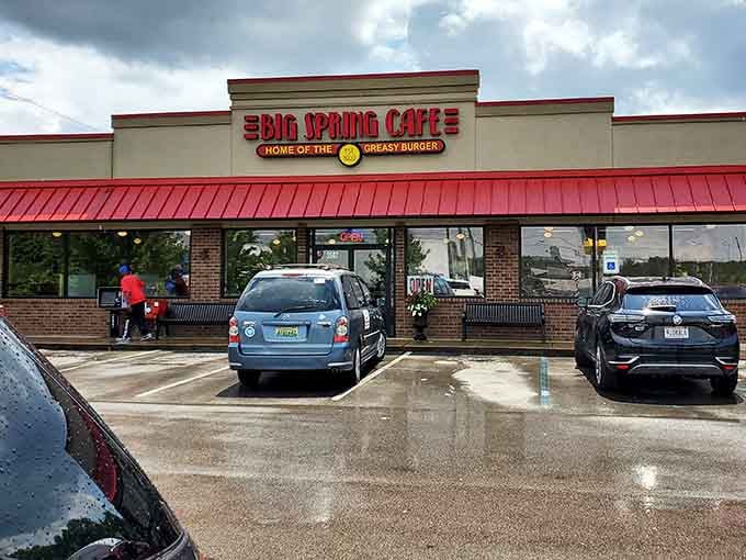 That bright red roof and packed parking lot tell you everything: this is where the locals eat lunch.
