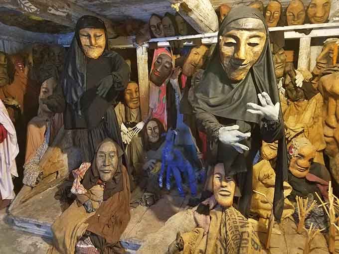 Step into a world where giant puppets gather like old friends at the most imaginative dinner party ever thrown.