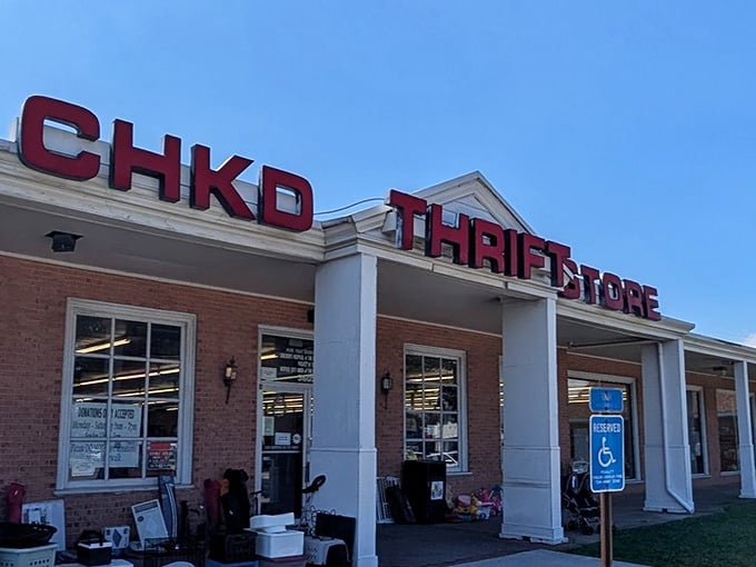 Those bold red letters against a perfect blue sky promise treasure hunting with a purpose inside.