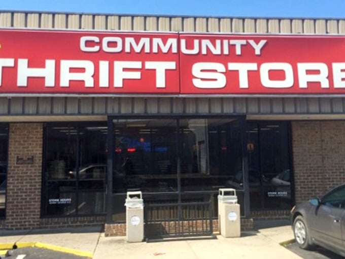 That bold red sign beckons like a lighthouse for bargain hunters seeking treasures at unbeatable prices.