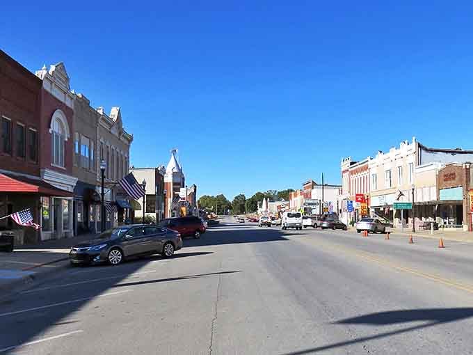 Main Street stretches wide and welcoming, where storefronts whisper stories from another century's gentle pace.
