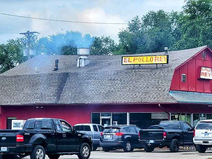 The bright red barn of El Pollo Rey stands like a beacon of smoky chicken paradise. That aroma will haunt your dreams!
