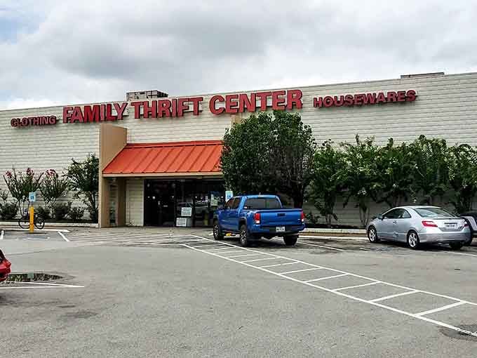 That orange awning welcomes you like a friendly wave, promising treasures hiding inside this sprawling Houston thrift paradise.