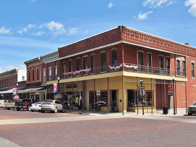 Fort Scott's historic brick buildings stand like sentinels of time, their balconies whispering stories from the Old West.