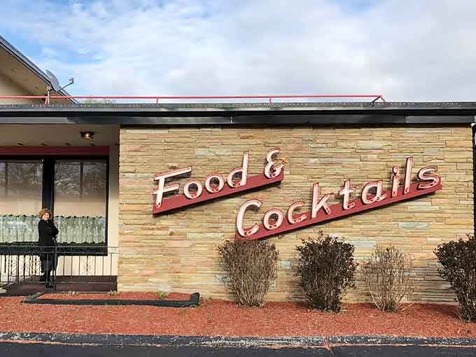 That classic "Food & Cocktails" sign promises exactly what you need after a long day &ndash; comfort and libations!