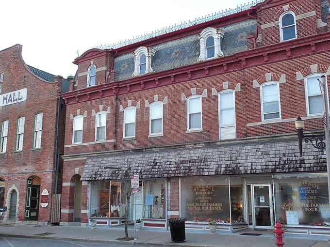 These red brick storefronts stand proud like they've been holding down Main Street since your grandparents were kids.