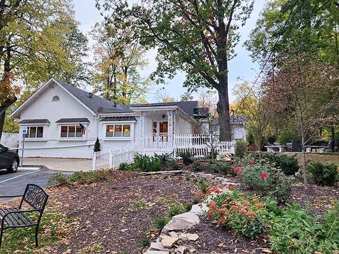 A charming white cottage that promises fried chicken dreams. This isn't just a restaurant—it's grandma's house with better parking!