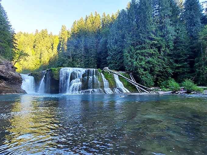 Nature's curtain call spreads across the rocks in multiple streams, creating a pool so blue it's almost unreal.
