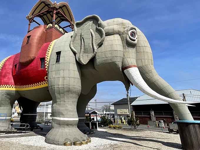 Lucy the Elephant stands tall against the blue sky, a six-story pachyderm palace that's been stopping traffic since the 1880s.