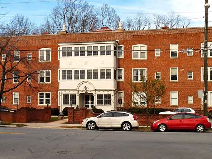 Classic brick apartments with white trim prove that affordable housing can still have architectural dignity and charm.