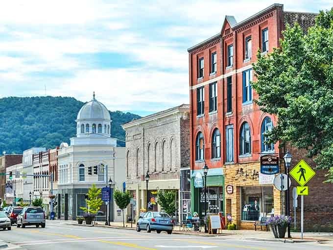 That white-domed courthouse rising behind red brick storefronts looks like a postcard from a gentler America.