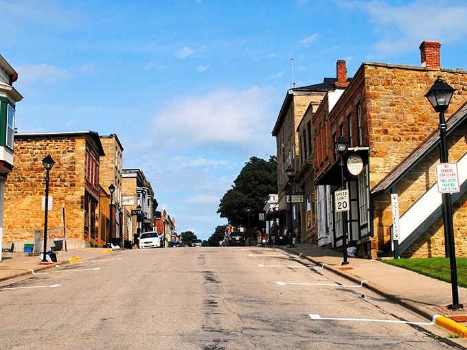 These golden limestone buildings glow like butter in the afternoon sun, creating a Main Street worth savoring slowly.