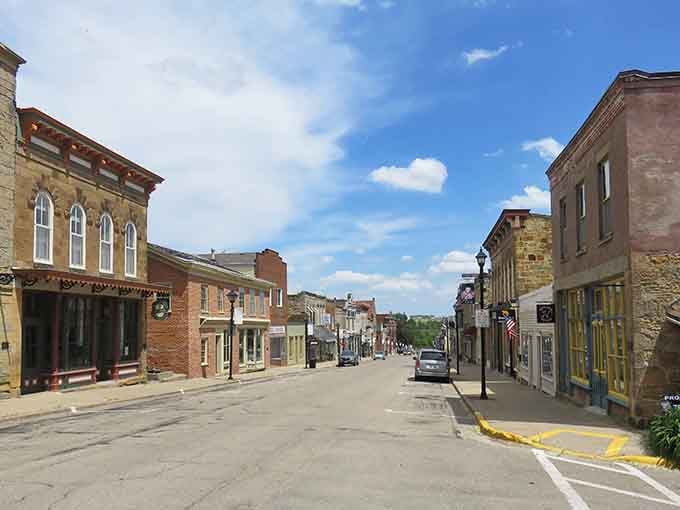Historic stone buildings line this street like they're auditioning for a Norman Rockwell painting come to life.