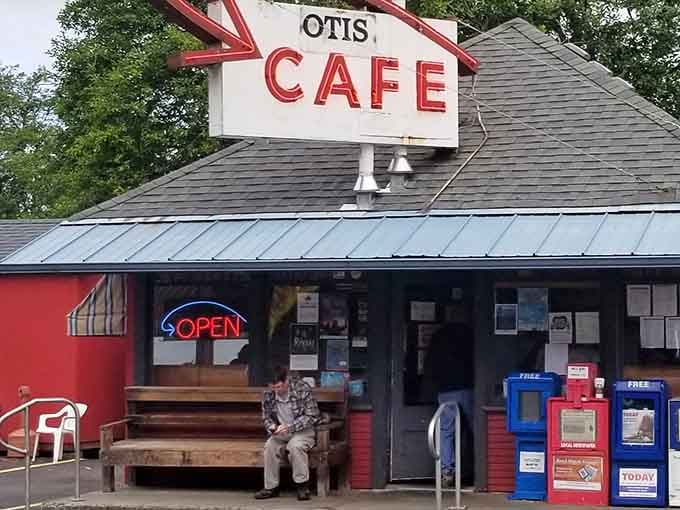 That classic roadside sign and wooden bench tell you everything: this is where real breakfast happens, friend.