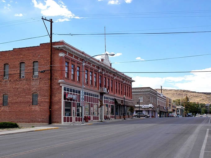 Historic brick buildings line this charming street like old friends gathering for their weekly coffee chat.