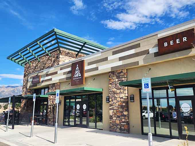 Modern meets rustic at this Albuquerque gem where stone and steel create pizza paradise.