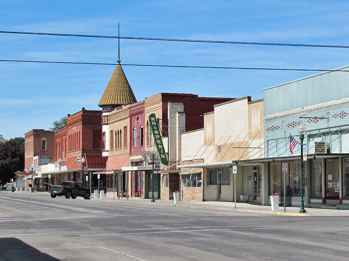 That distinctive turret tower stands like a Victorian exclamation point over historic brick buildings that refuse to fade away.
