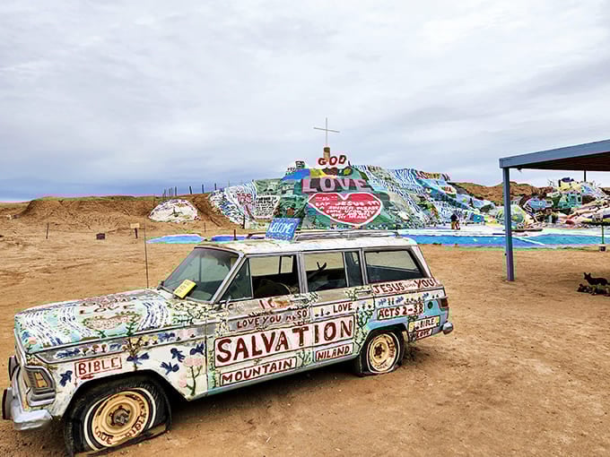 Love painted in rainbow colors across desert clay - this mountain of devotion rises like hope itself.