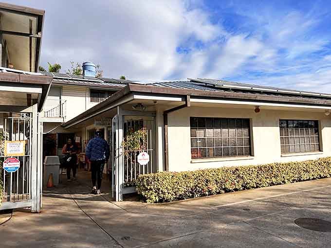 Sam Sato's modest exterior hides culinary treasures within. The unassuming building houses noodle magic that locals line up for daily.