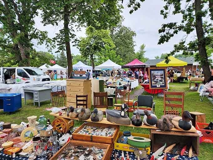 Vintage decoys and wooden treasures spread across green grass under colorful tents&mdash;this is treasure hunting at its finest.
