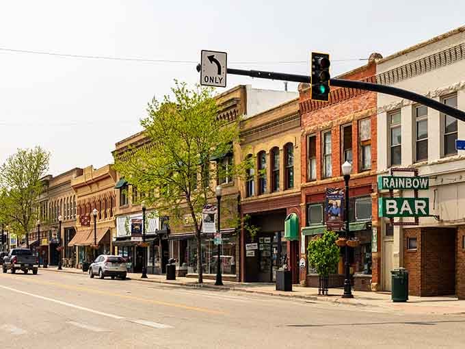 Sheridan's historic Main Street looks like a movie set with its vintage storefronts and classic Western charm. The Rainbow Bar sign has welcomed thirsty travelers for generations.