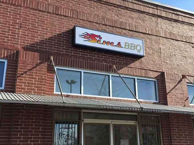 Sims Bar-B-Que's flaming logo promises heat before you even walk through that brick facade.