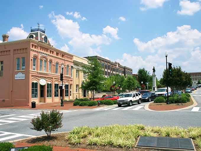 Spartanburg's downtown radiates charm with its peachy-pink buildings and circular brick plaza under endless blue skies.