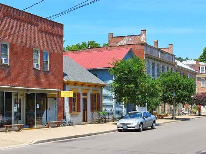 Brick buildings and colorful roofs create a streetscape that looks like someone pressed pause on the 1800s.