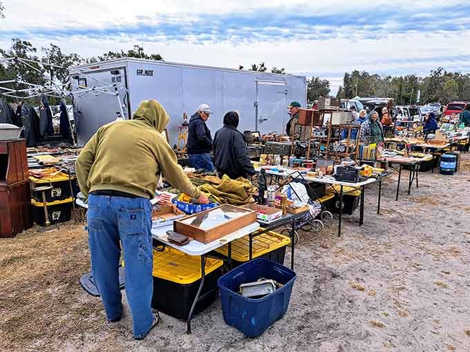Early birds browse tables loaded with treasures under open skies where every item tells a story.