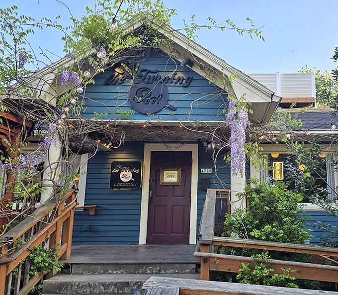 The Turning Peel Pizza: A charming blue cottage where pizza dreams come true. Wisteria frames the entrance like Mother Nature's own welcome sign.
