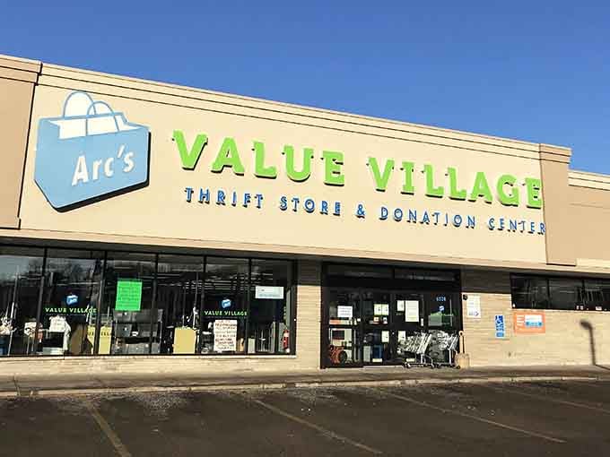 That cheerful blue and green signage practically waves hello, promising treasures waiting inside for the patient hunter.