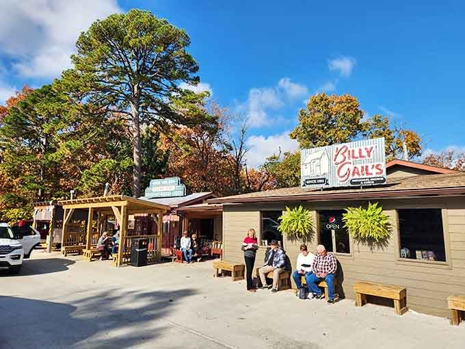 Look at those folks gathering on wooden benches under autumn trees, waiting for home-cooked comfort food worth the wait.