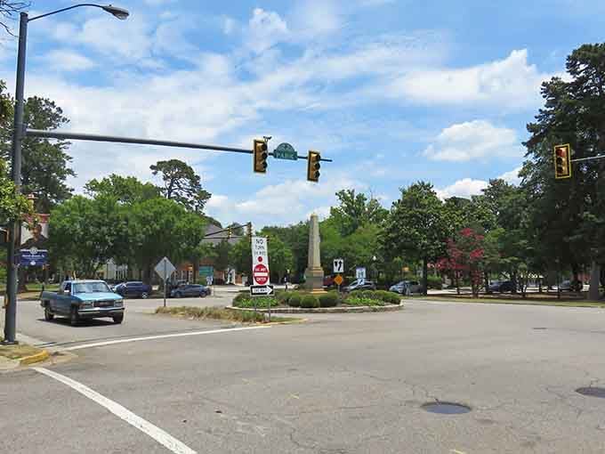 That monument standing proud in the center tells you this town values its history as much as its hospitality.