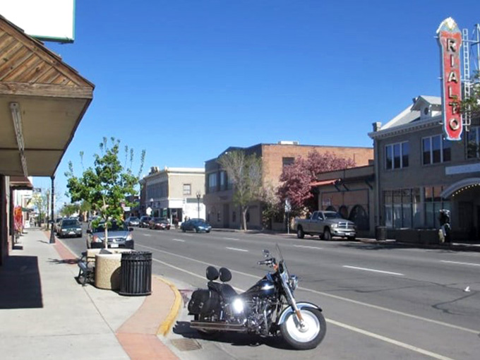 That vintage Rialto sign towers over Main Street like a beacon from a simpler, more affordable time.