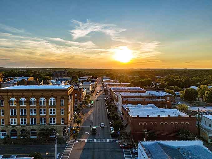 Golden hour transforms this main street into pure magic, proving beautiful sunsets don't cost extra on your utility bill.