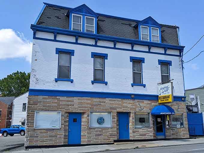 The classic white and blue facade practically whispers "come in for coffee" like a friendly neighbor waving from the porch.