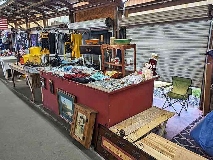 That vintage booth overflows with colorful finds, from framed art to household goods, all begging for new homes.