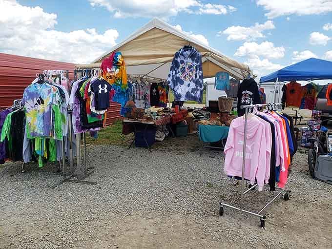 Colorful clothing racks under blue skies. Nothing says "flea market magic" like finding that perfect tie-dye shirt you didn't know you needed.